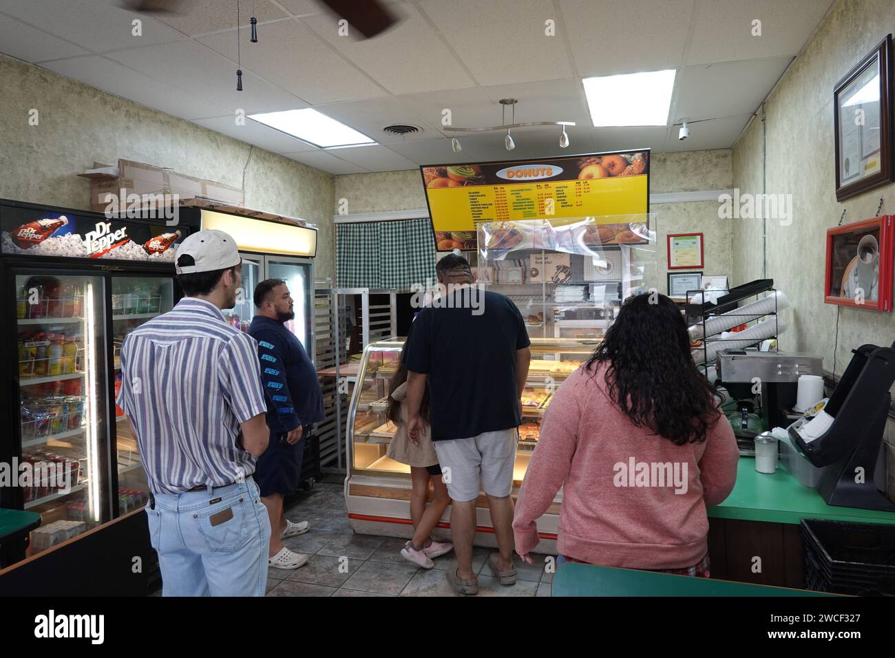Customers waiting in line at a donut shop - November 2023 Stock Photo ...