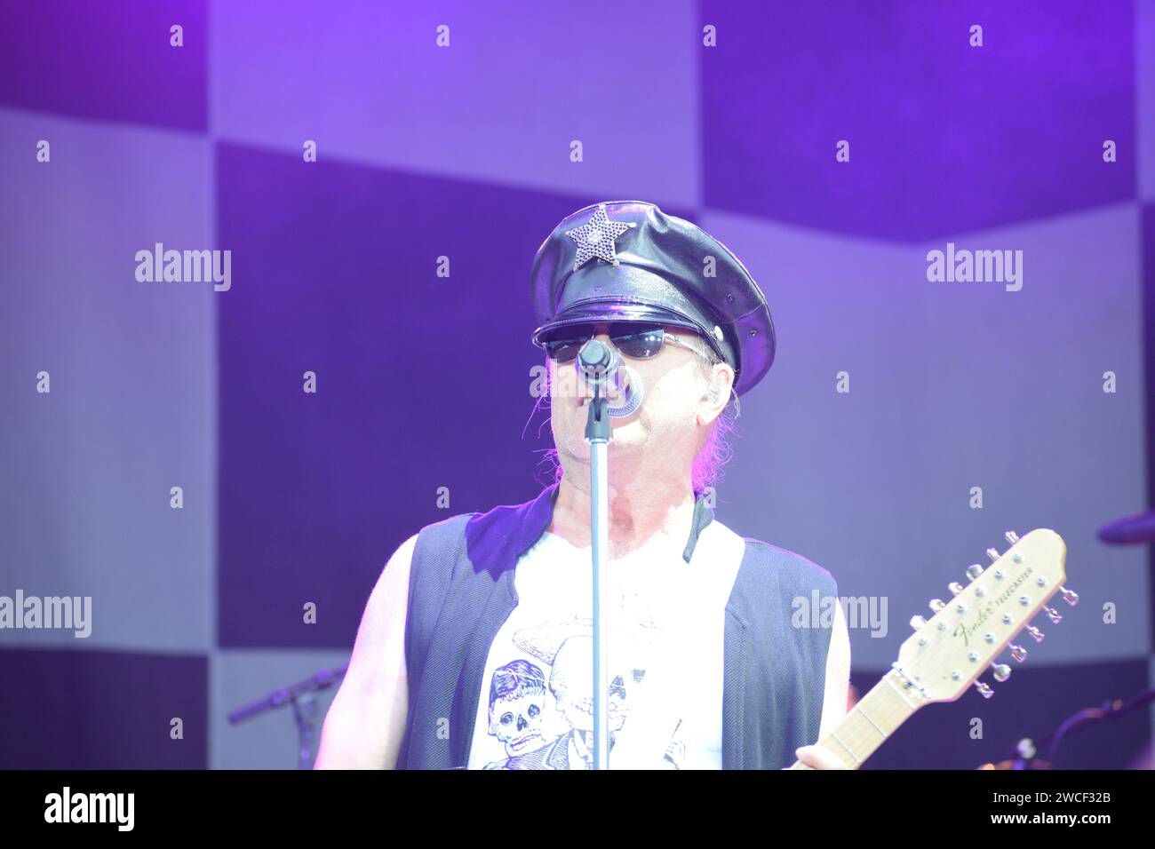 Cheap Trick performs in Sherman Texas, during what would become a rain ...