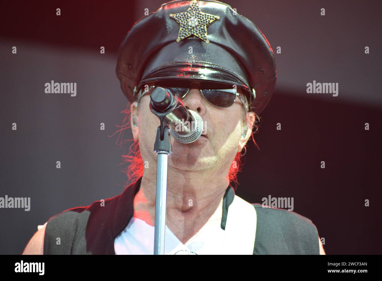 Cheap Trick performs in Sherman Texas, during what would become a rain ...