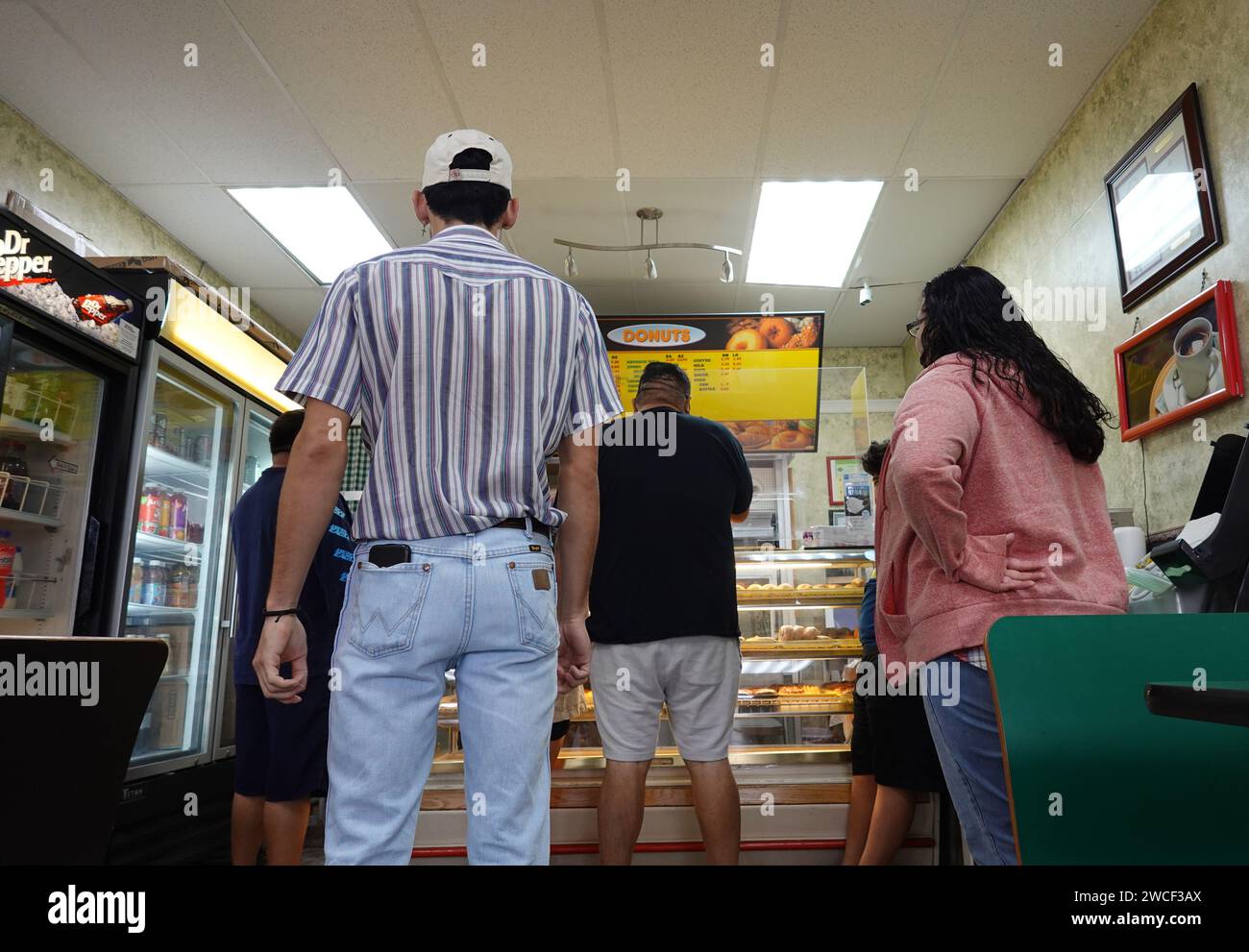 Customers waiting in line at a donut shop - November 2023 Stock Photo ...