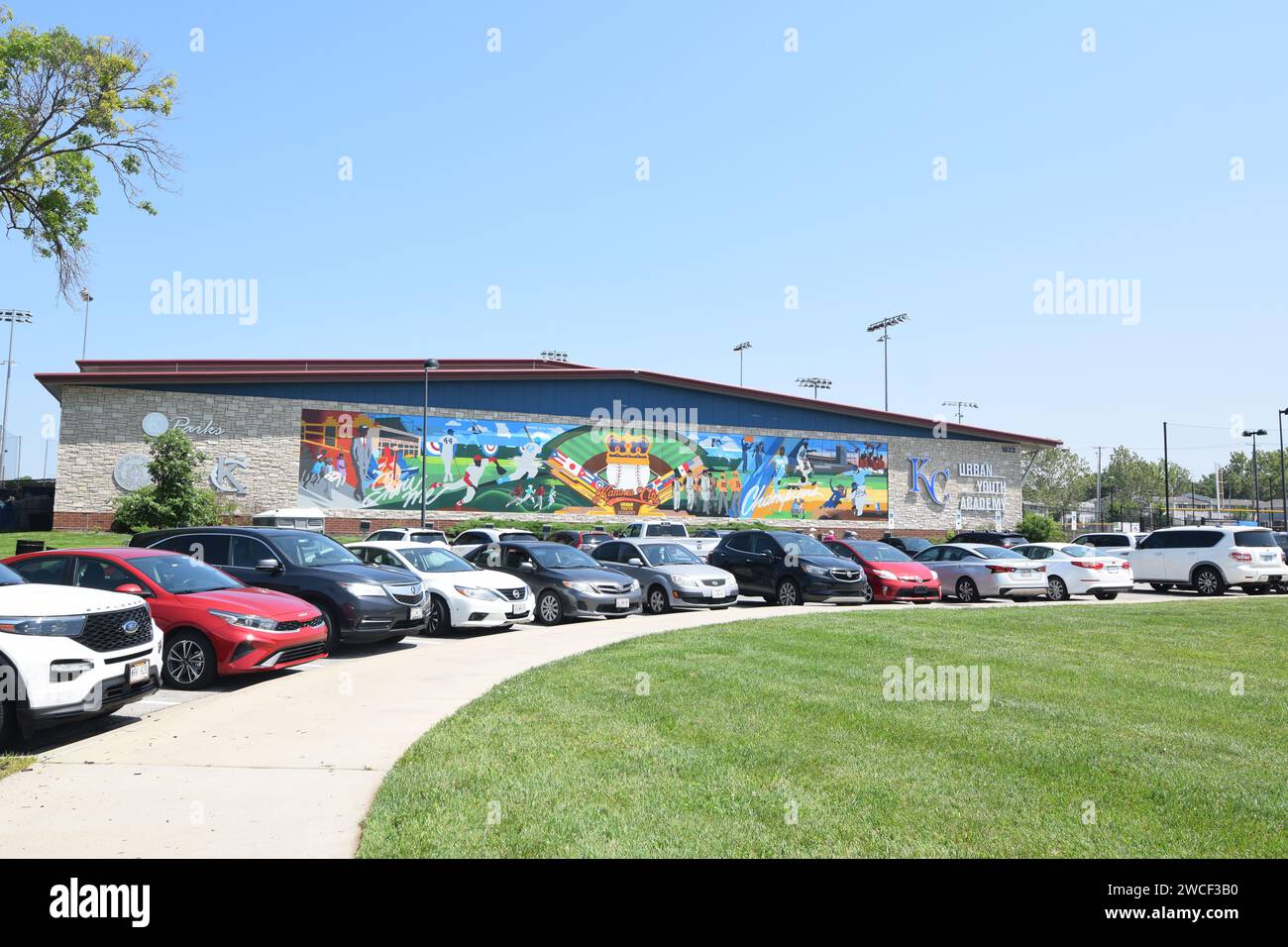 Cars parked in front of the Kansas City Urban Youth Academy baseball ...