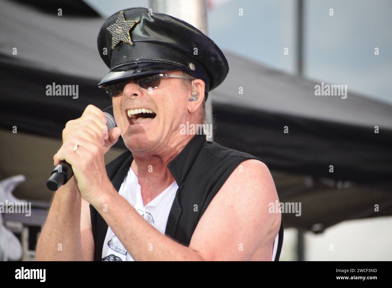 Cheap Trick performs in Sherman Texas, during what would become a rain ...