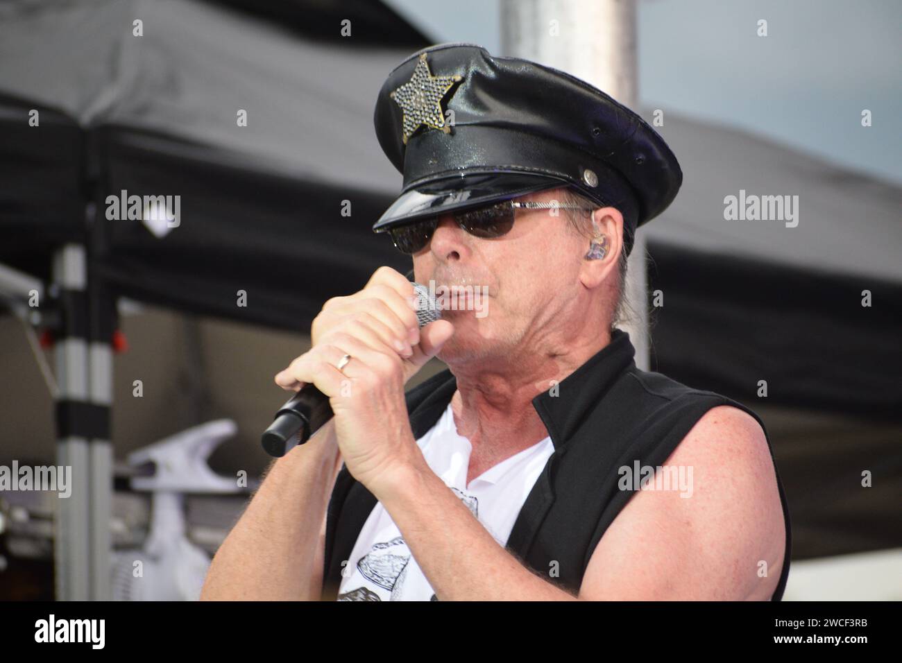 Cheap Trick performs in Sherman Texas, during what would become a rain ...