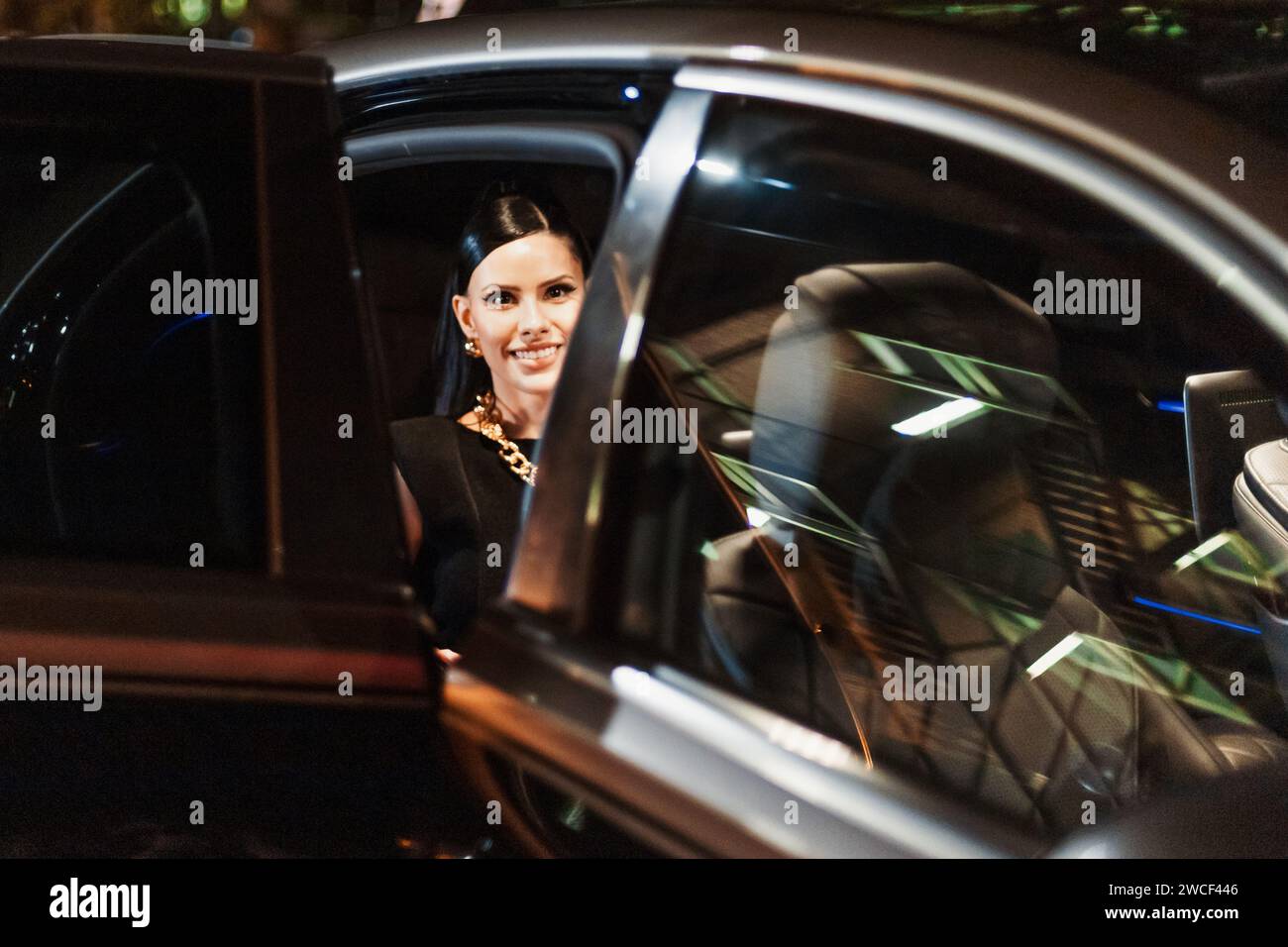 A guest outside Versace show during Milan Fashion Week Womenswear ...