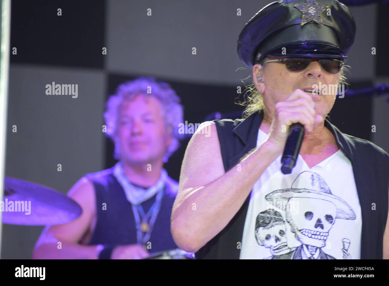 Cheap Trick performs in Sherman Texas, during what would become a rain ...