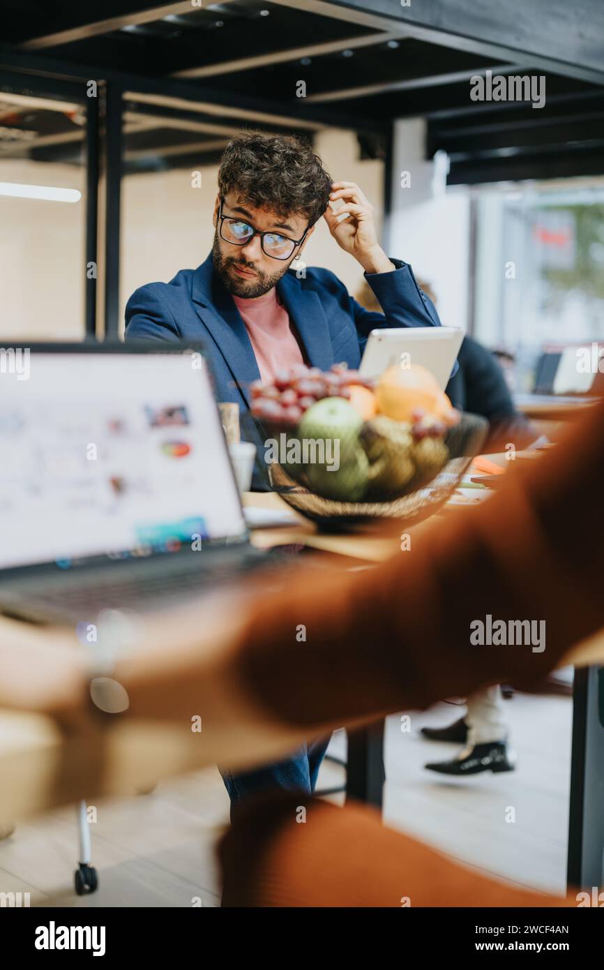 Diverse team analyzing statistics and sharing ideas for business ...