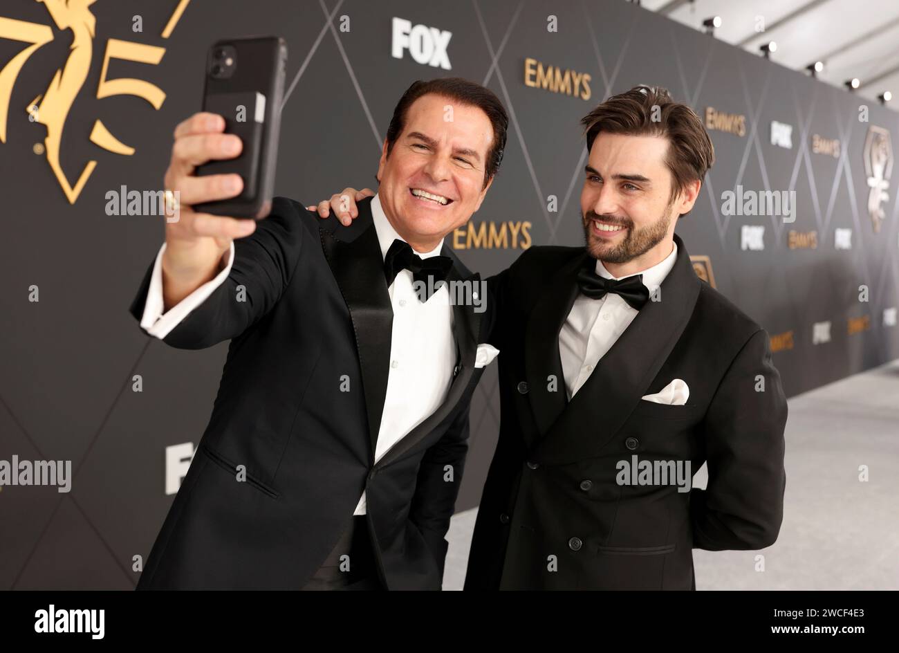 Vincent De Paul and Stephen Manas walk the red carpet at the 75th Emmy ...