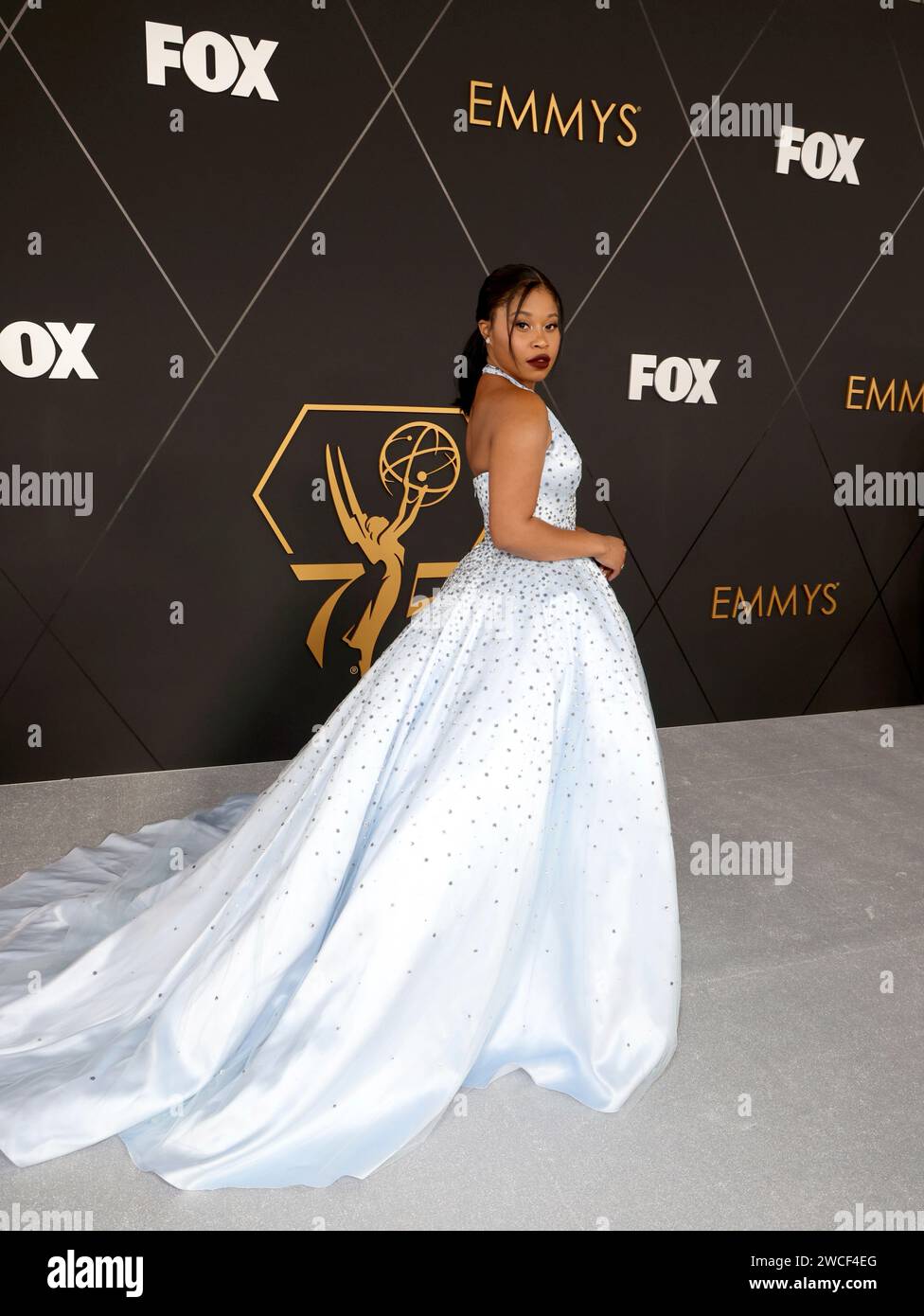 Dominique Fishback walks the red carpet at the 75th Emmy Awards on ...