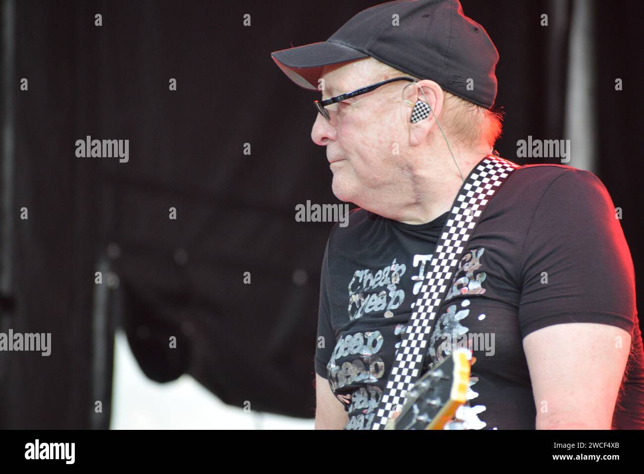 Cheap Trick performs in Sherman Texas, during what would become a rain ...