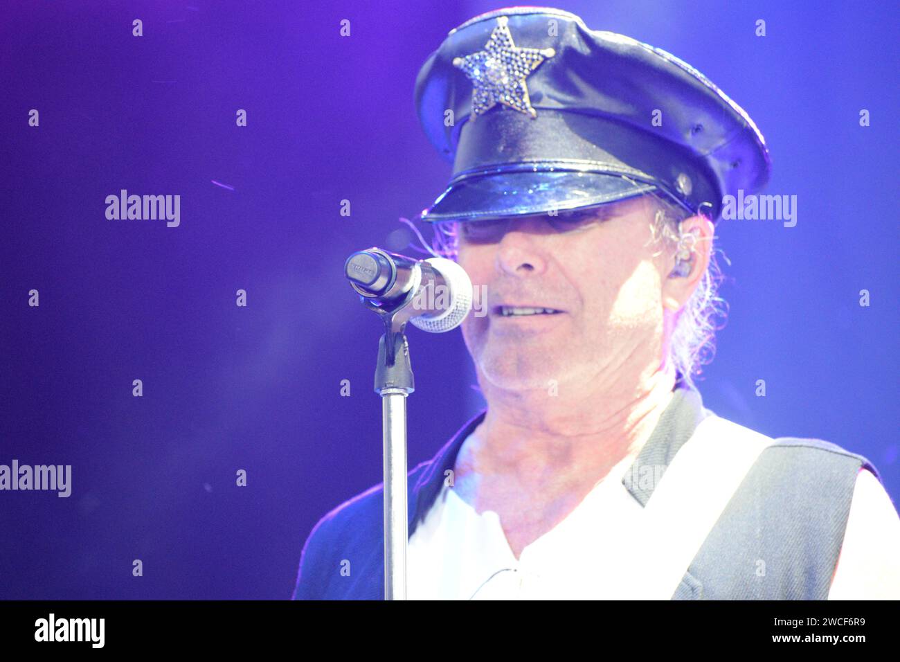 Cheap Trick performs in Sherman Texas, during what would become a rain ...