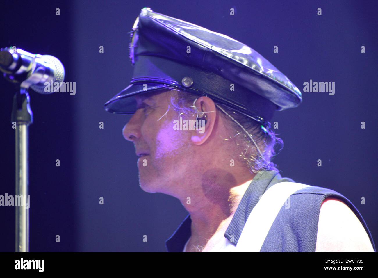 Cheap Trick performs in Sherman Texas, during what would become a rain ...