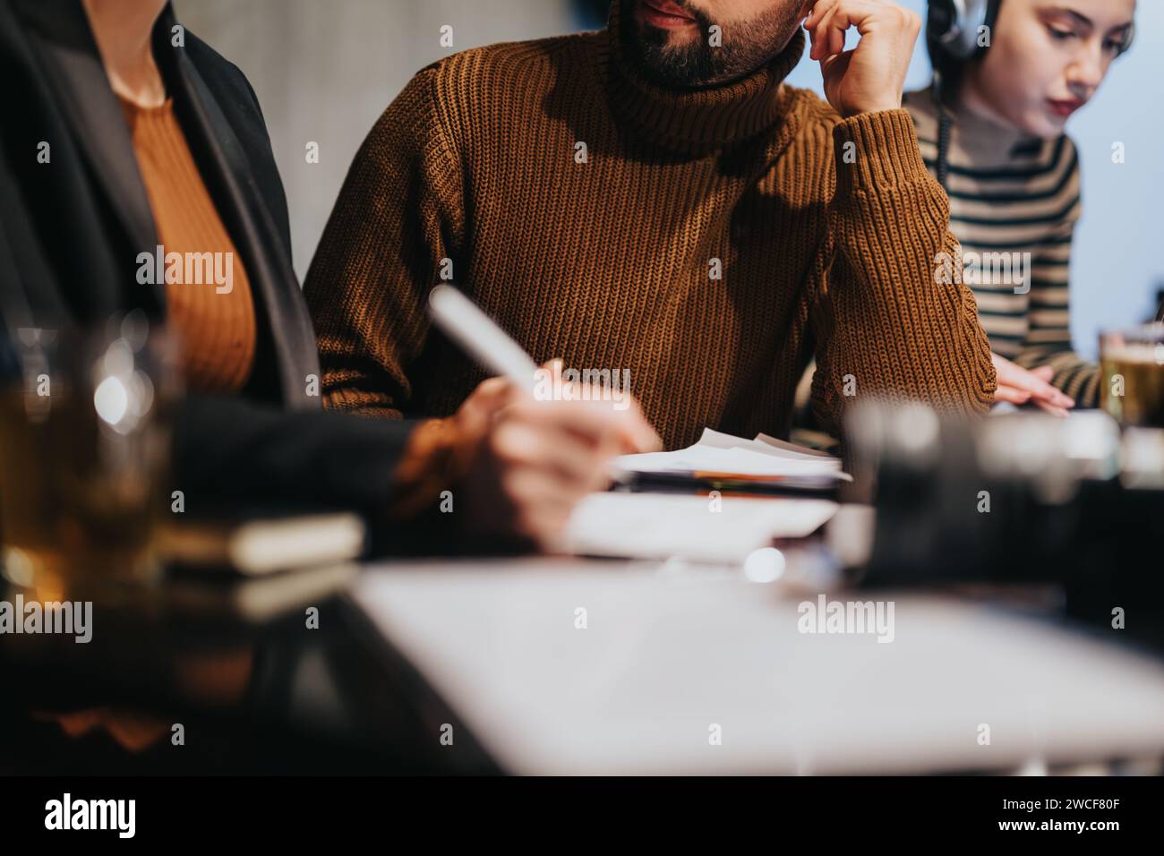 Successful business team analyzing sales statistics in corporate office ...