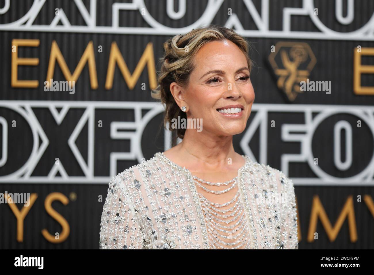 Maria Bello poses for a Red Carpet portrait at the 75th Emmy Awards on ...
