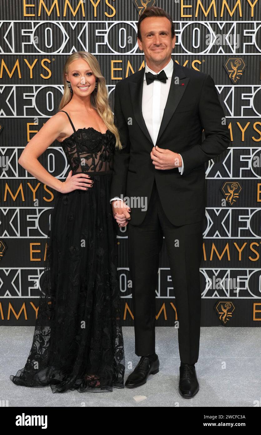 Kayla Radomski, left, and Jason Segel pose for a Red Carpet portrait at ...