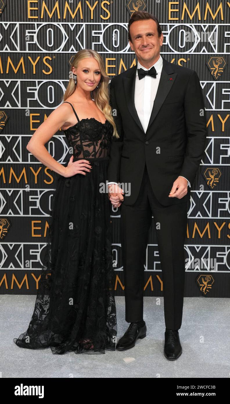 Kayla Radomski, left, and Jason Segel pose for a Red Carpet portrait at ...