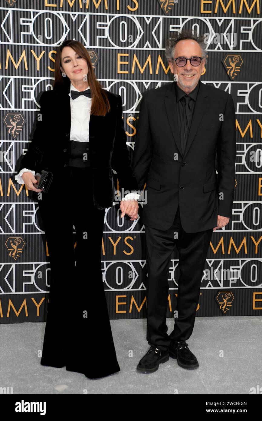 Monica Bellucci, left, and Tim Burton arrive at the 75th Primetime Emmy ...