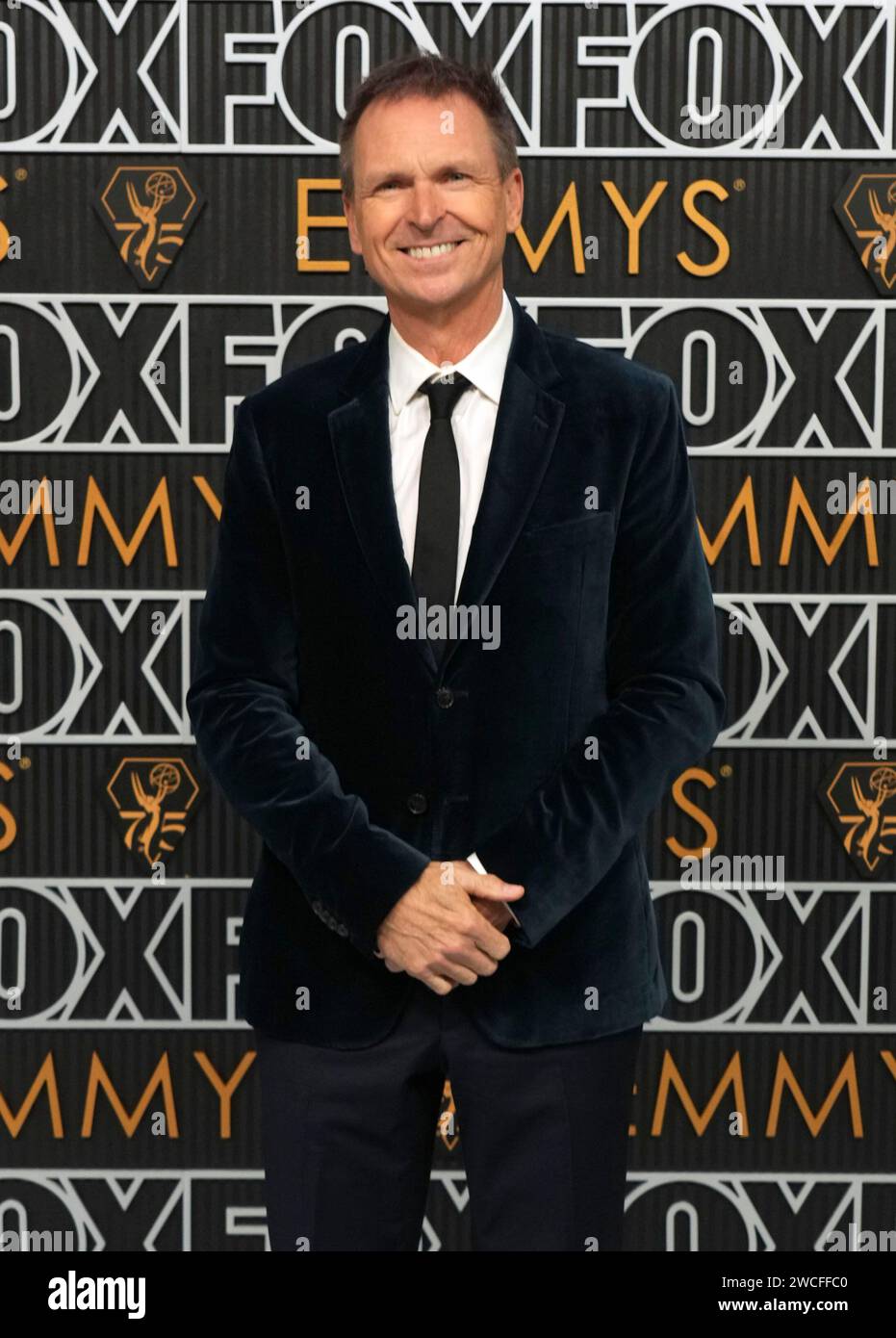 Phil Keoghan poses for a Red Carpet portrait at the 75th Emmy Awards on ...