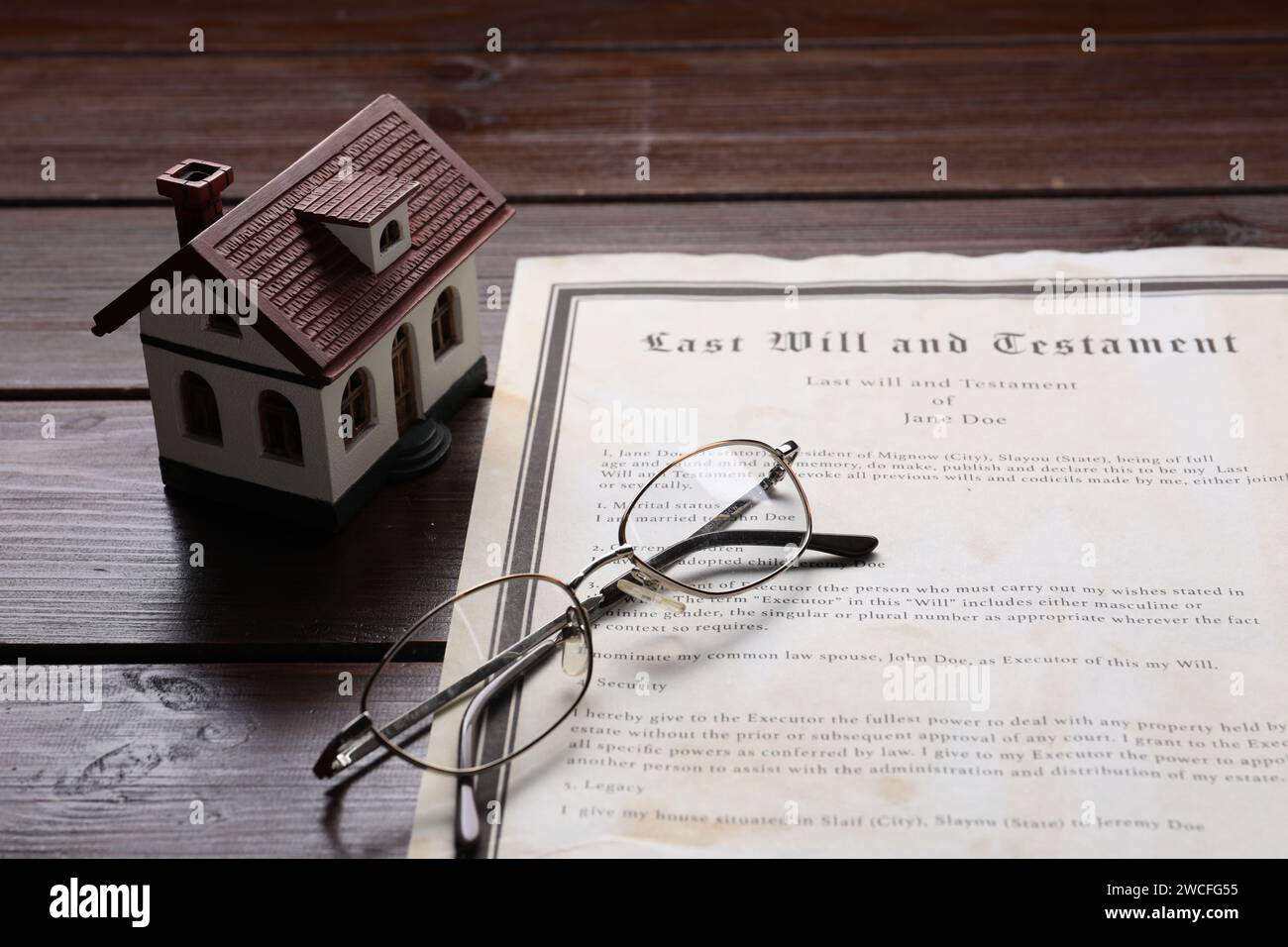 Last Will and Testament, house model and glasses on wooden table ...