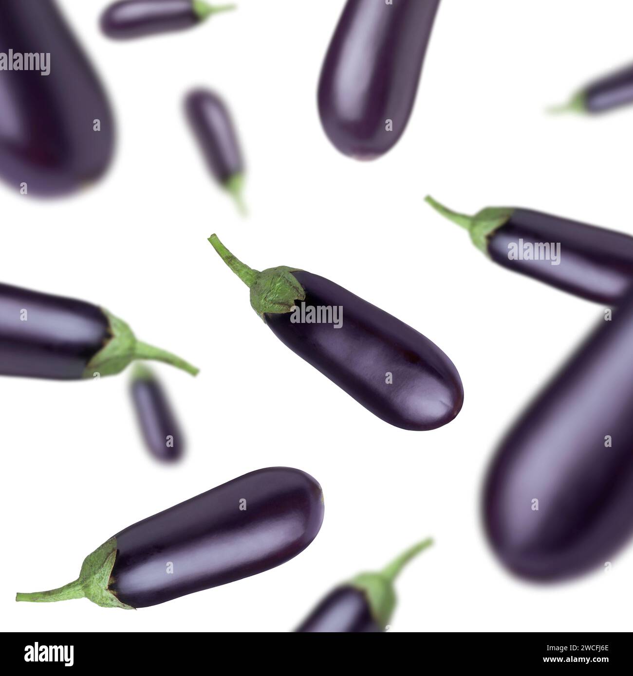 Fresh whole eggplants falling on white background Stock Photo - Alamy