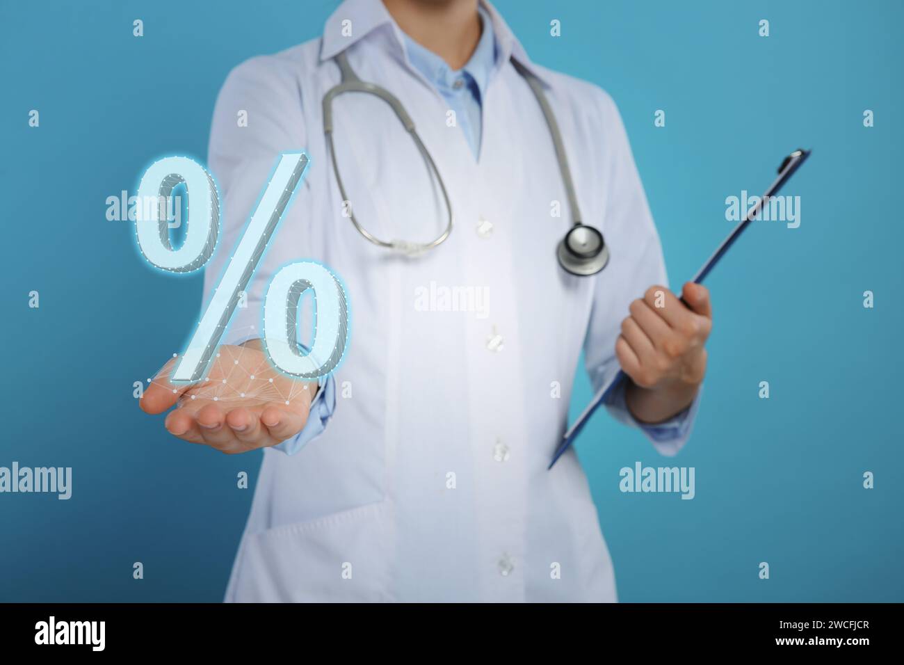 Discount offer. Doctor with stethoscope and clipboard holding percent ...