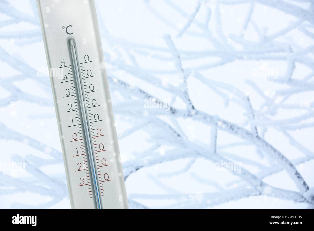 Thermometer showing temperature below zero outdoors on winter day Stock ...