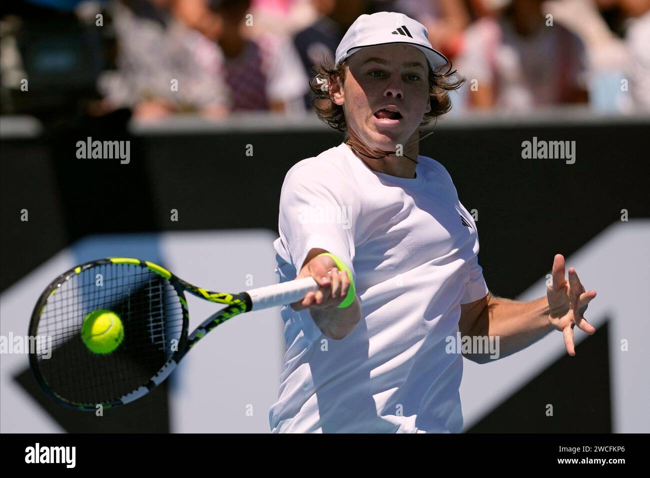 Alex Michelsen of the U.S. plays a forehand return to James McCabe of ...