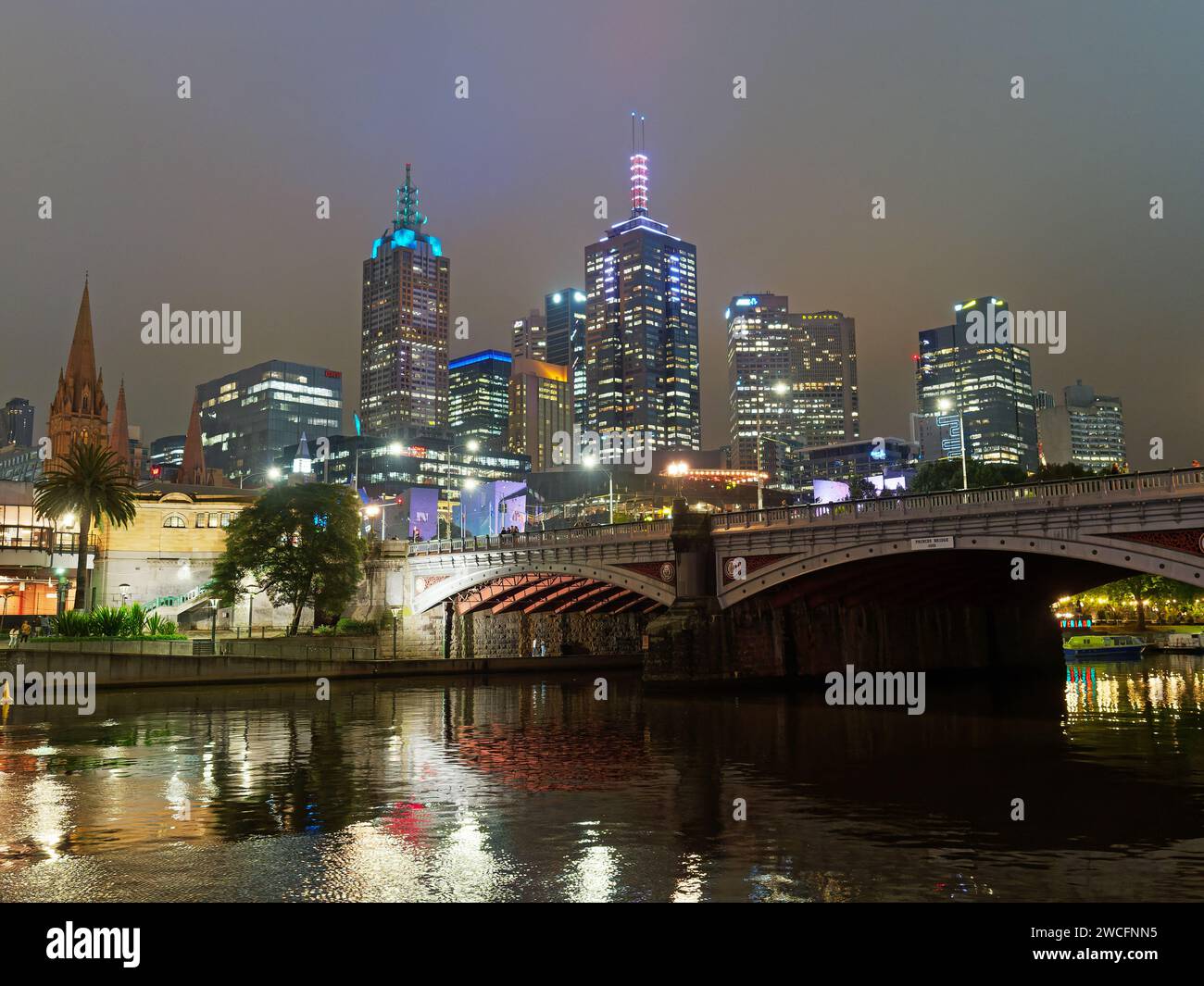 View at night of towers and commercial buildings alongside the Yarra ...