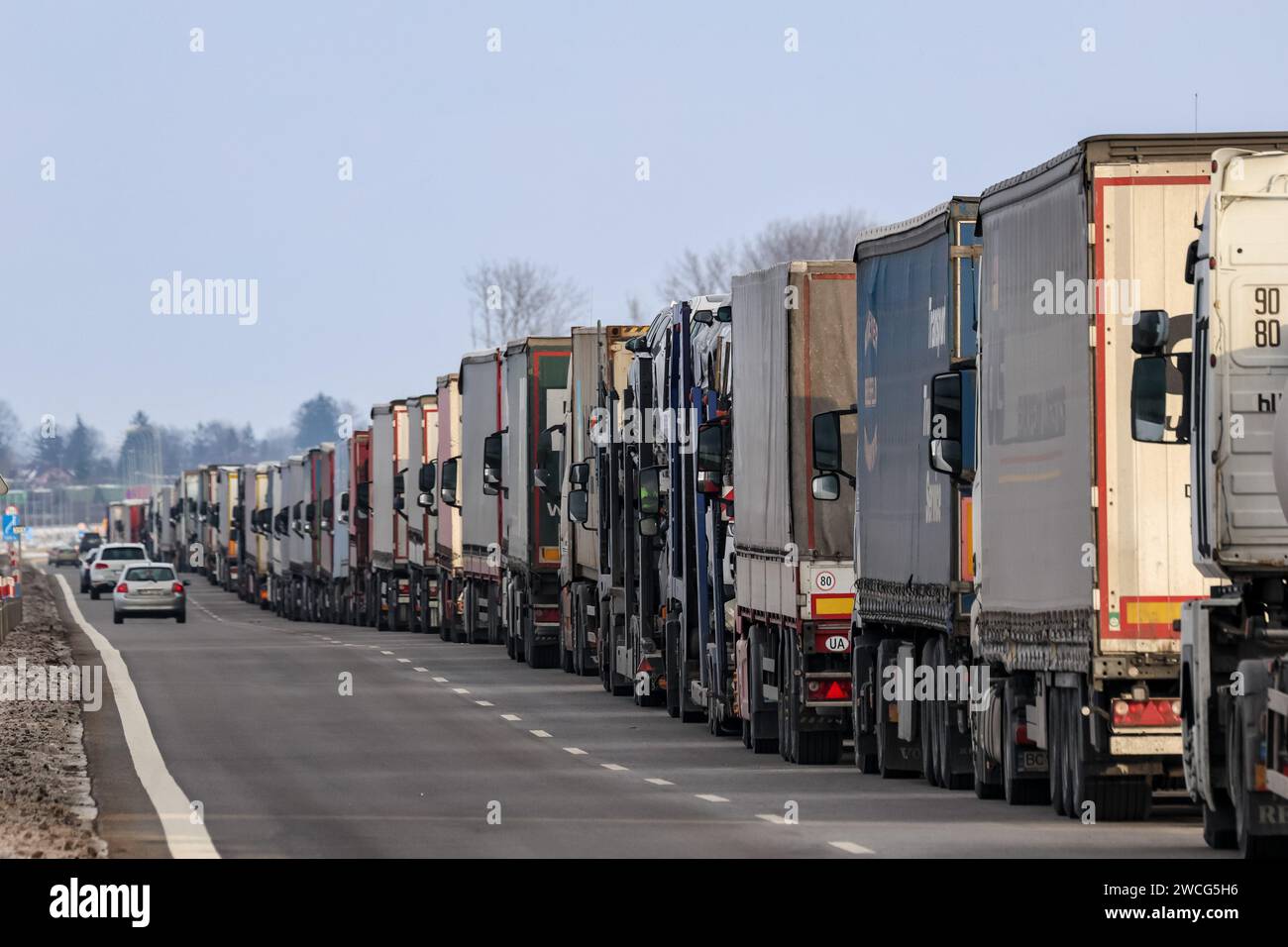 Trucks stand in a line to cross the border in Medyka as Polish ...