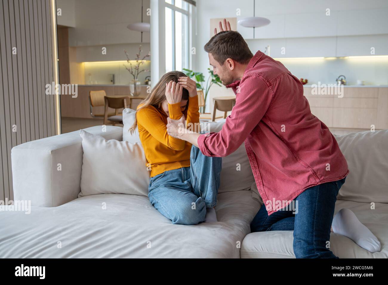 Domestic Violence. Abuser tyrant cruel man husband wants to hit swings ...