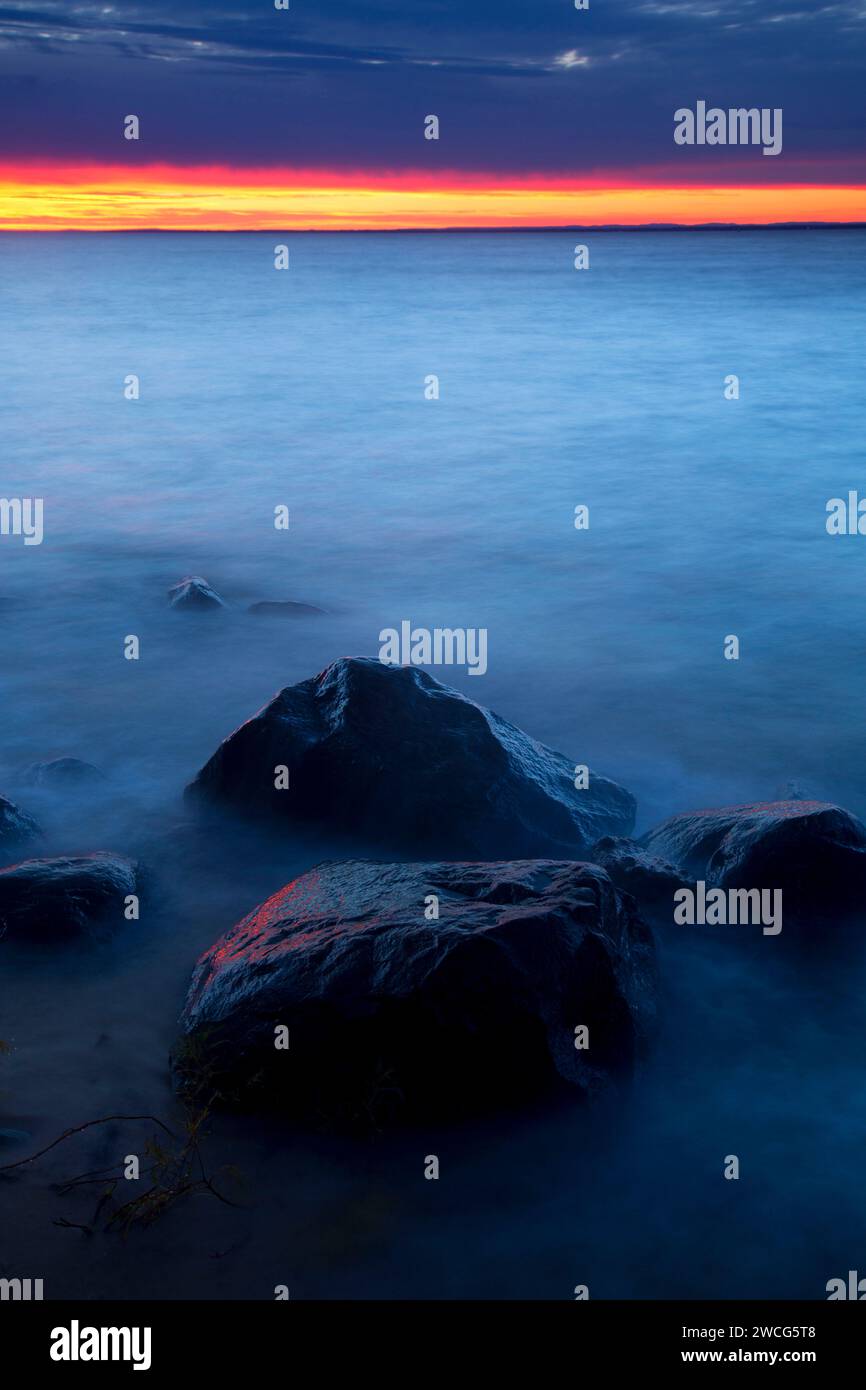 Chequamegon Bay on Lake Superior shoreline rocks at sunrise, Memorial ...