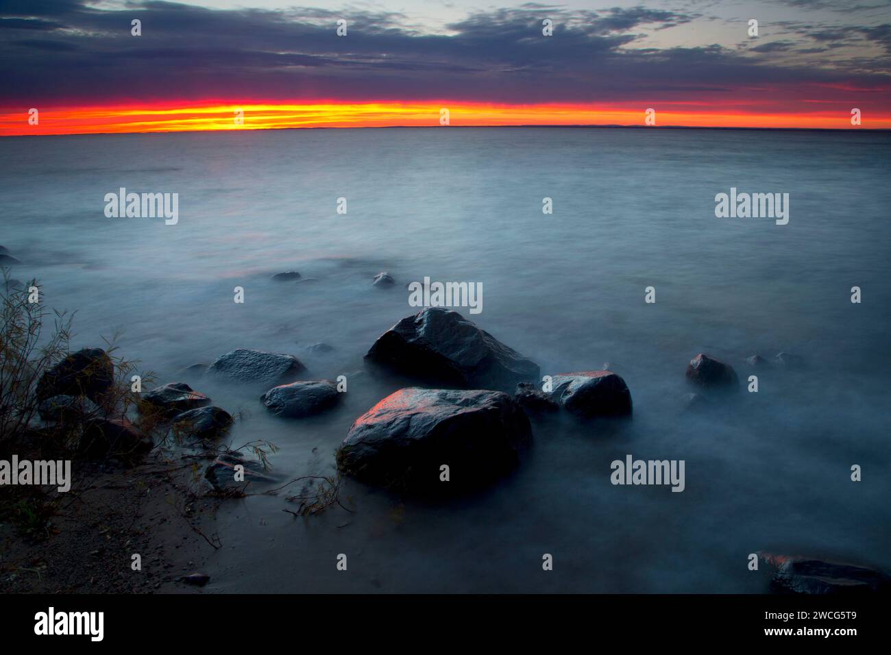 Chequamegon Bay on Lake Superior shoreline rocks at sunrise, Memorial ...