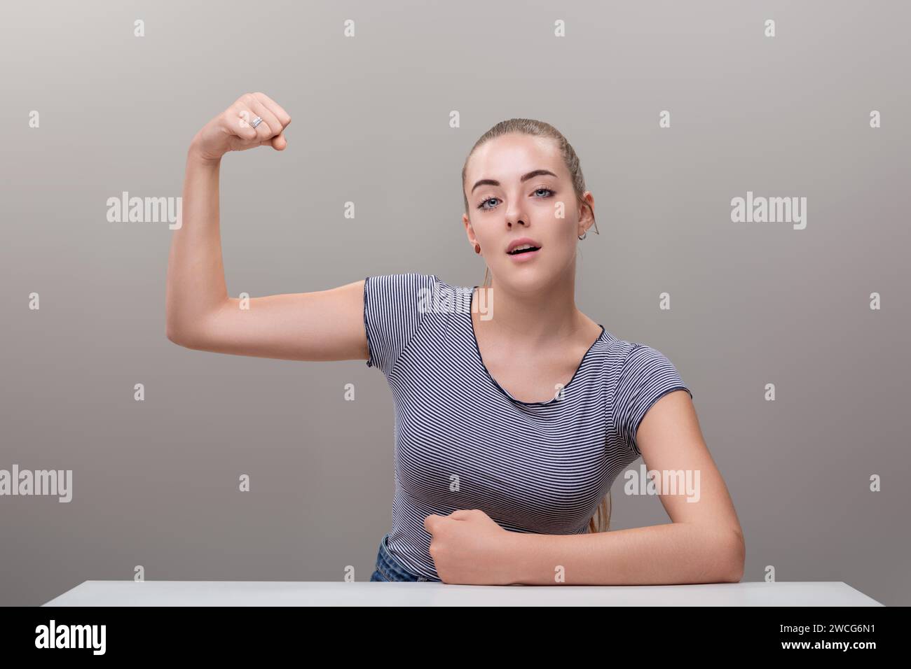 Strong woman muscles flexing flex hi-res stock photography and images ...