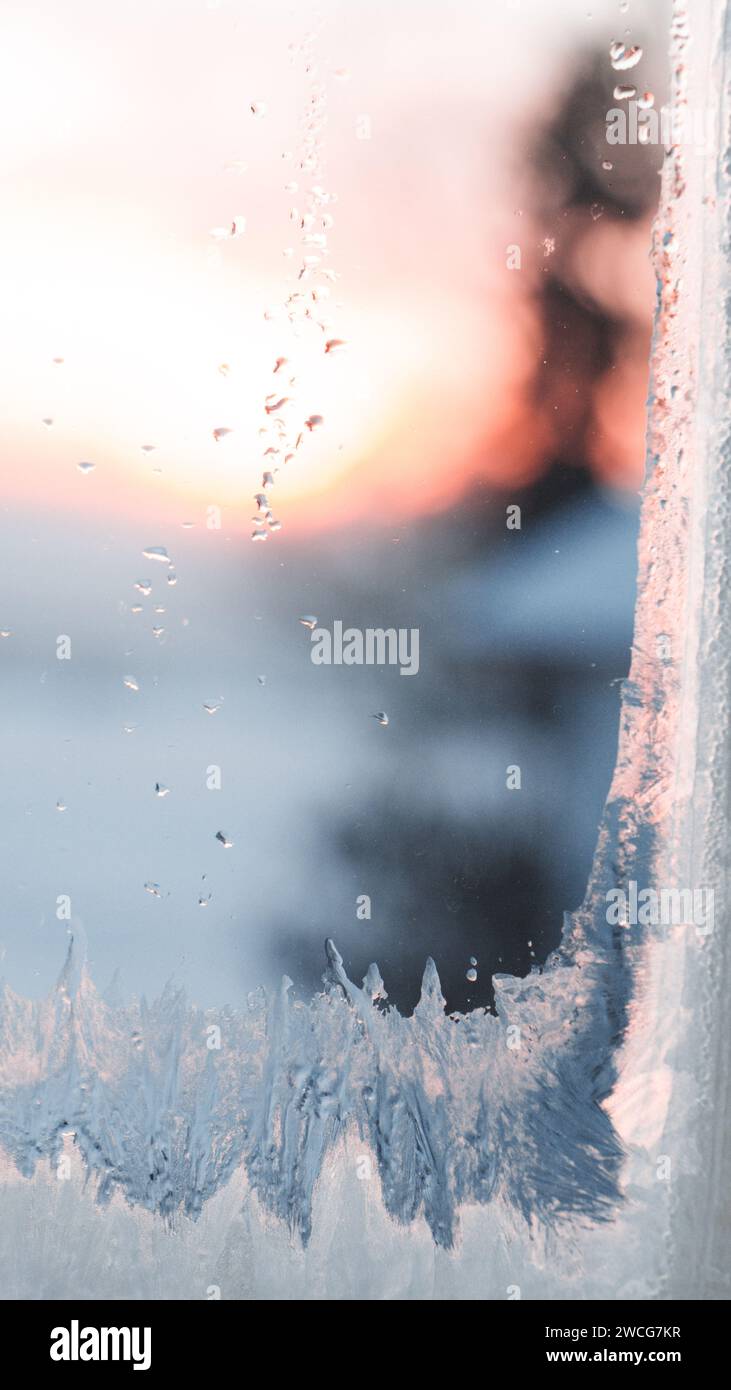 Winter sunrise through frosty window Stock Photo - Alamy