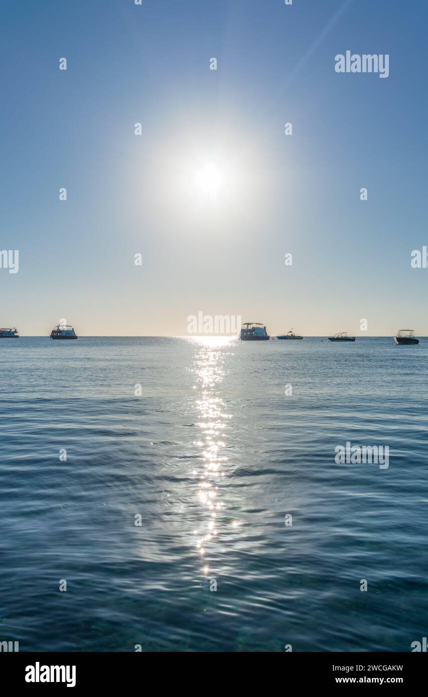 Sunrise over the sea. Panoramic seascape. Burning sky and shining ...
