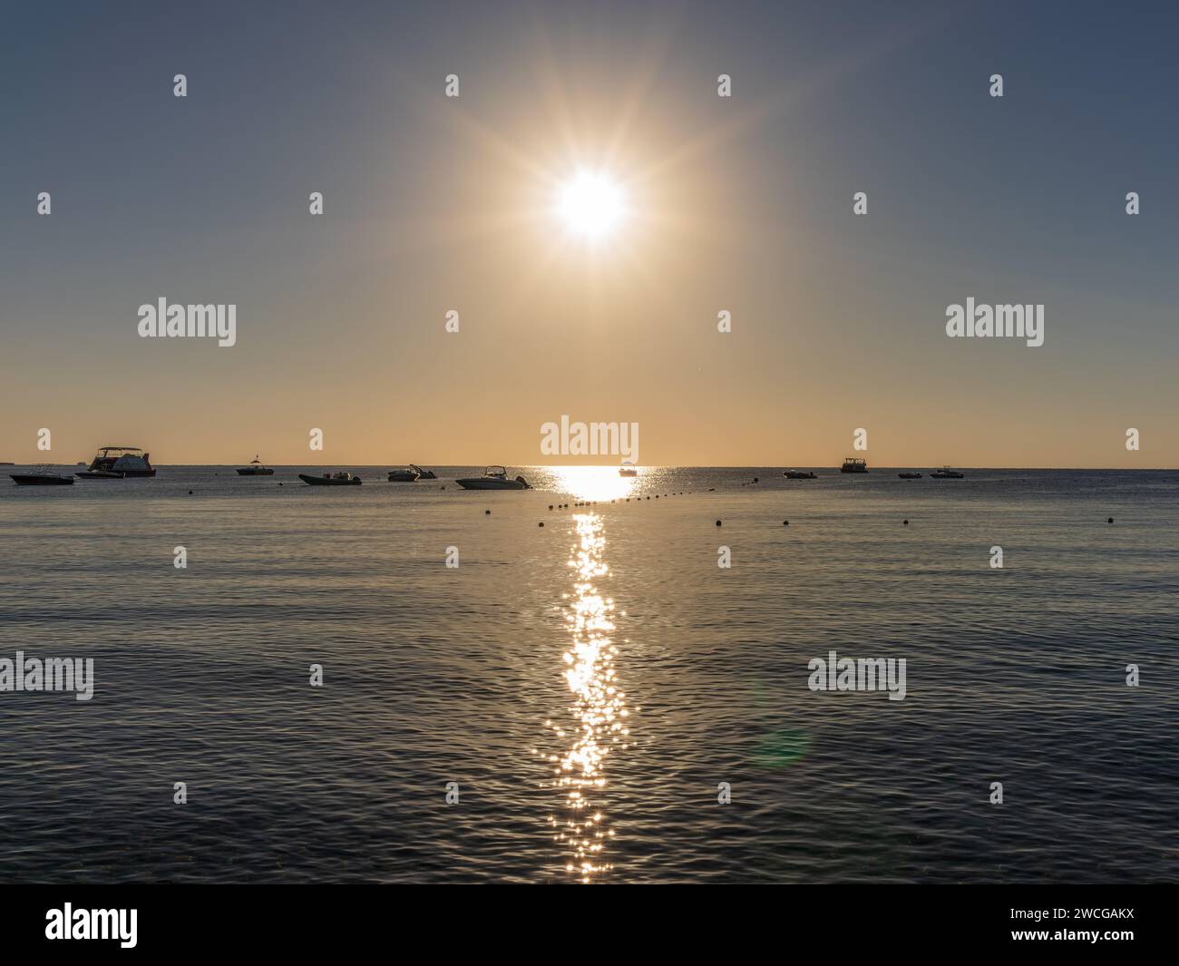 Sunrise over the sea. Panoramic seascape. Burning sky and shining ...