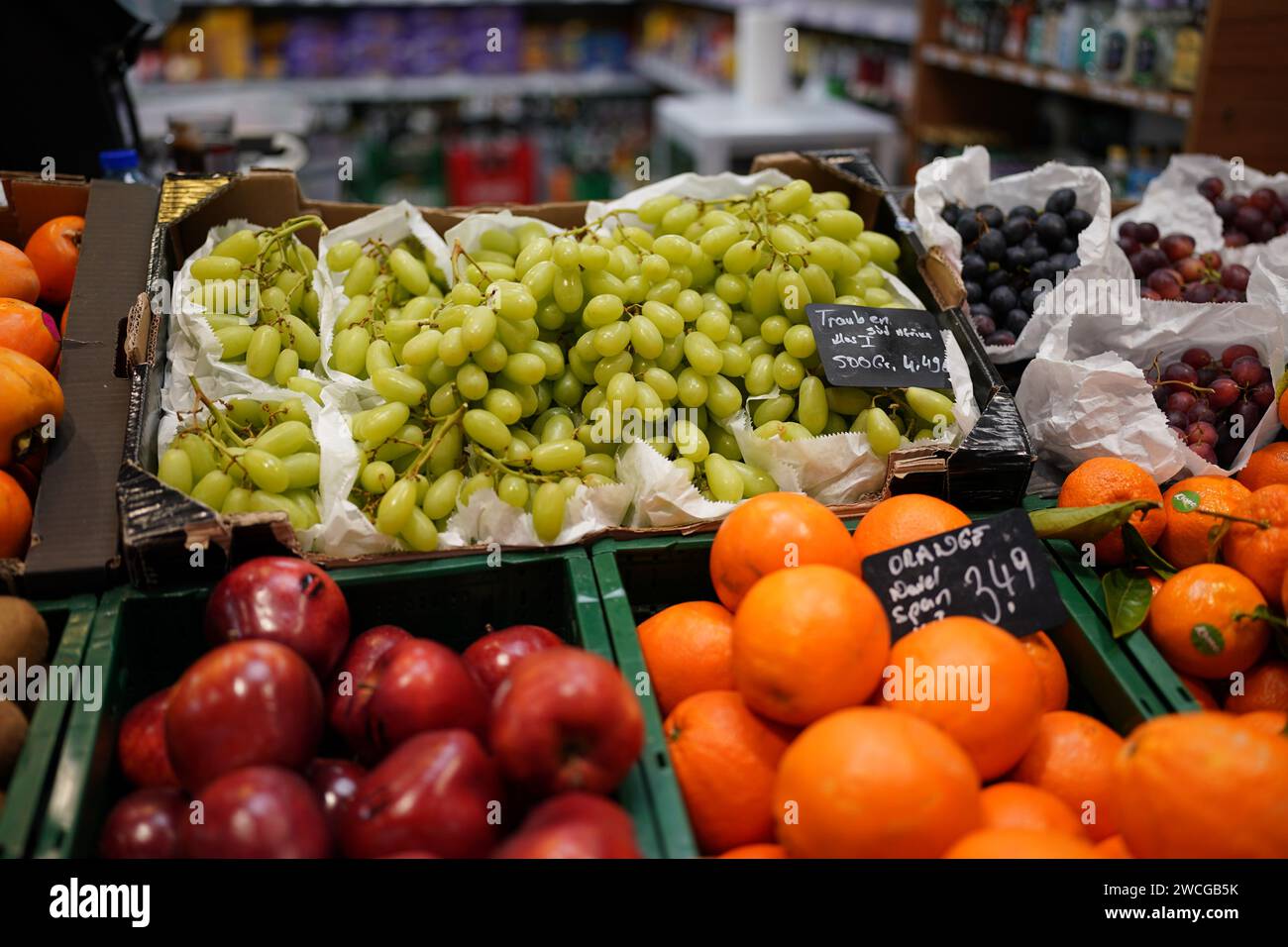 Hamburg, Germany. 15th Jan, 2024. Grapes and oranges on display in a ...