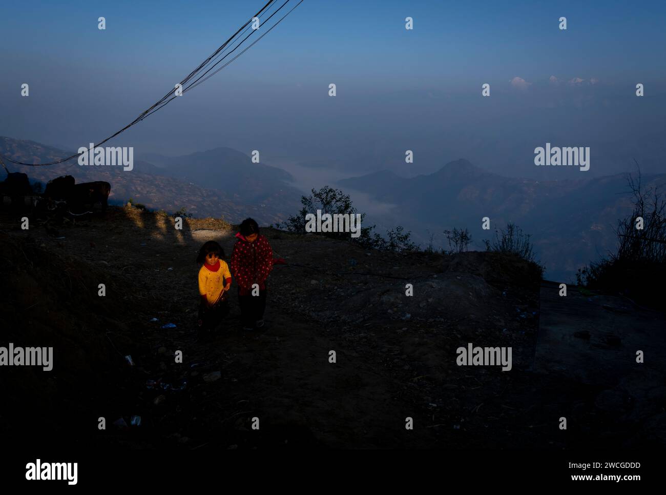 Children walk in the morning to attend to their daily chores on the ...