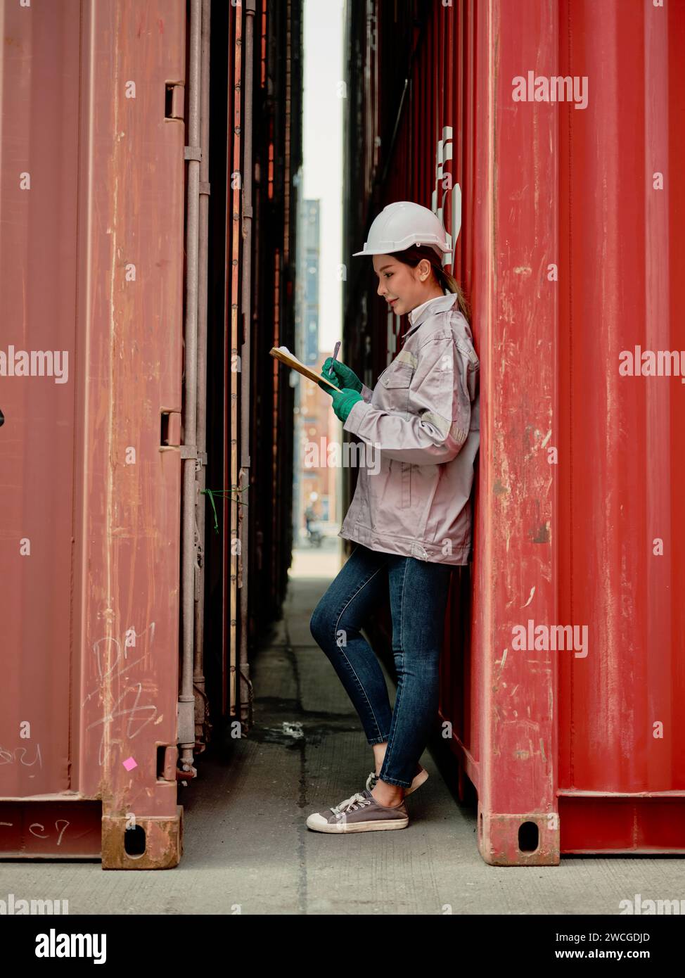 Portrait of asian woman worker holding clipboard and inspection and see ...