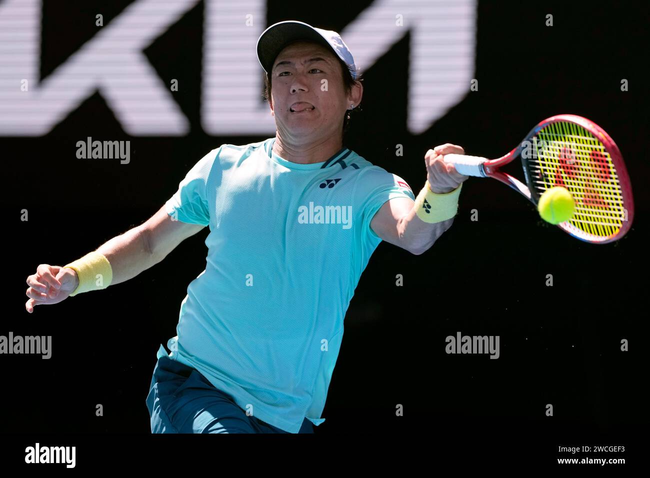 Yoshihito Nishioka of Japan plays a forehand return to Holger Rune of ...