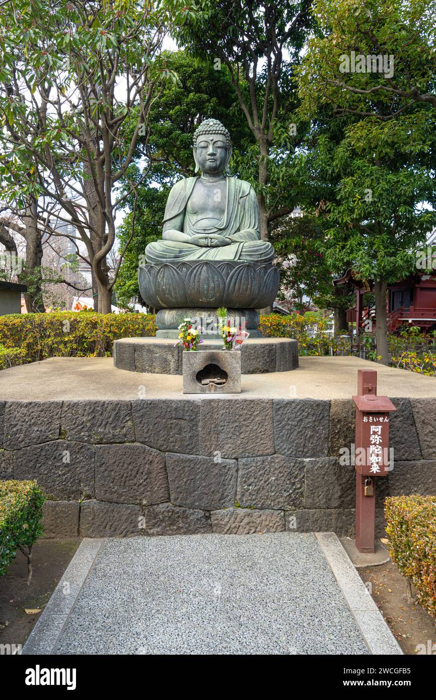 Tokyo, Japan. January 2024. view of the bronze statue of Amida Nyorai ...