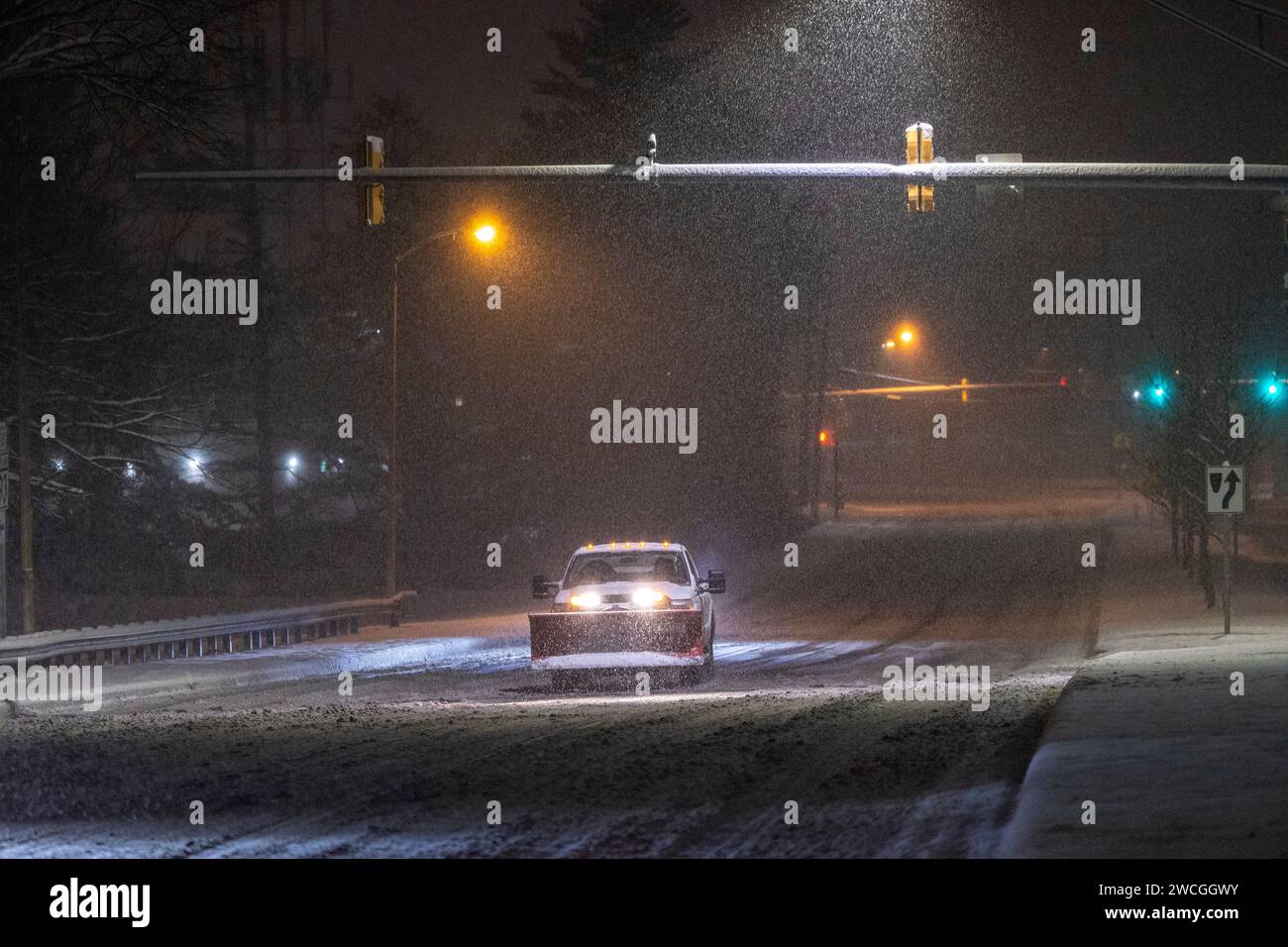 Silver Spring, Maryland, USA. 15th Jan, 2024. A snow plow drives past ...