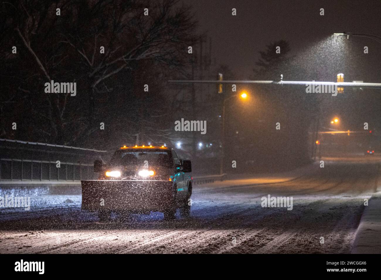 Silver Spring, Maryland, USA. 15th Jan, 2024. A snow plow drives past ...
