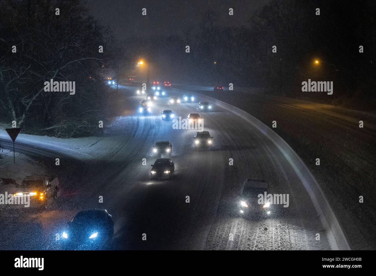 Silver Spring, Maryland, USA. 15th Jan, 2024. Snow falls on vehicles ...