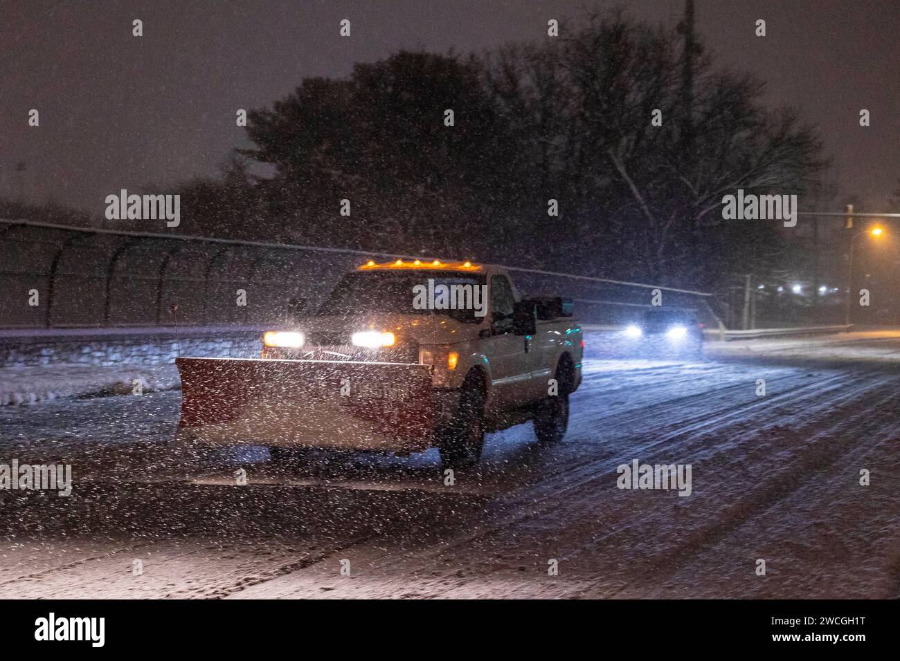 Silver Spring, Maryland, USA. 15th Jan, 2024. A snow plow drives past ...