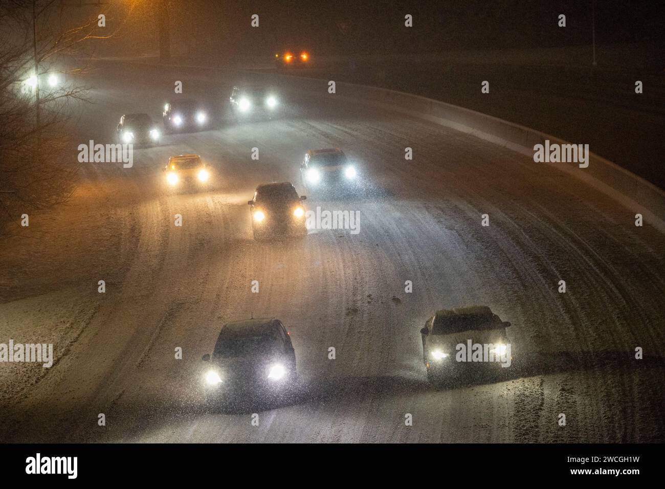 Silver Spring, Maryland, USA. 15th Jan, 2024. Snow falls on vehicles ...