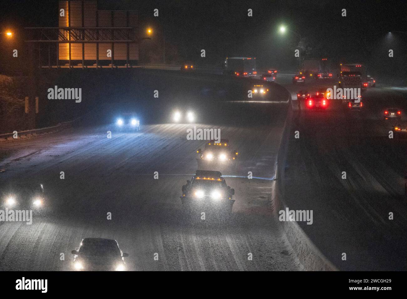 Silver Spring, Maryland, USA. 15th Jan, 2024. Snow falls on vehicles ...
