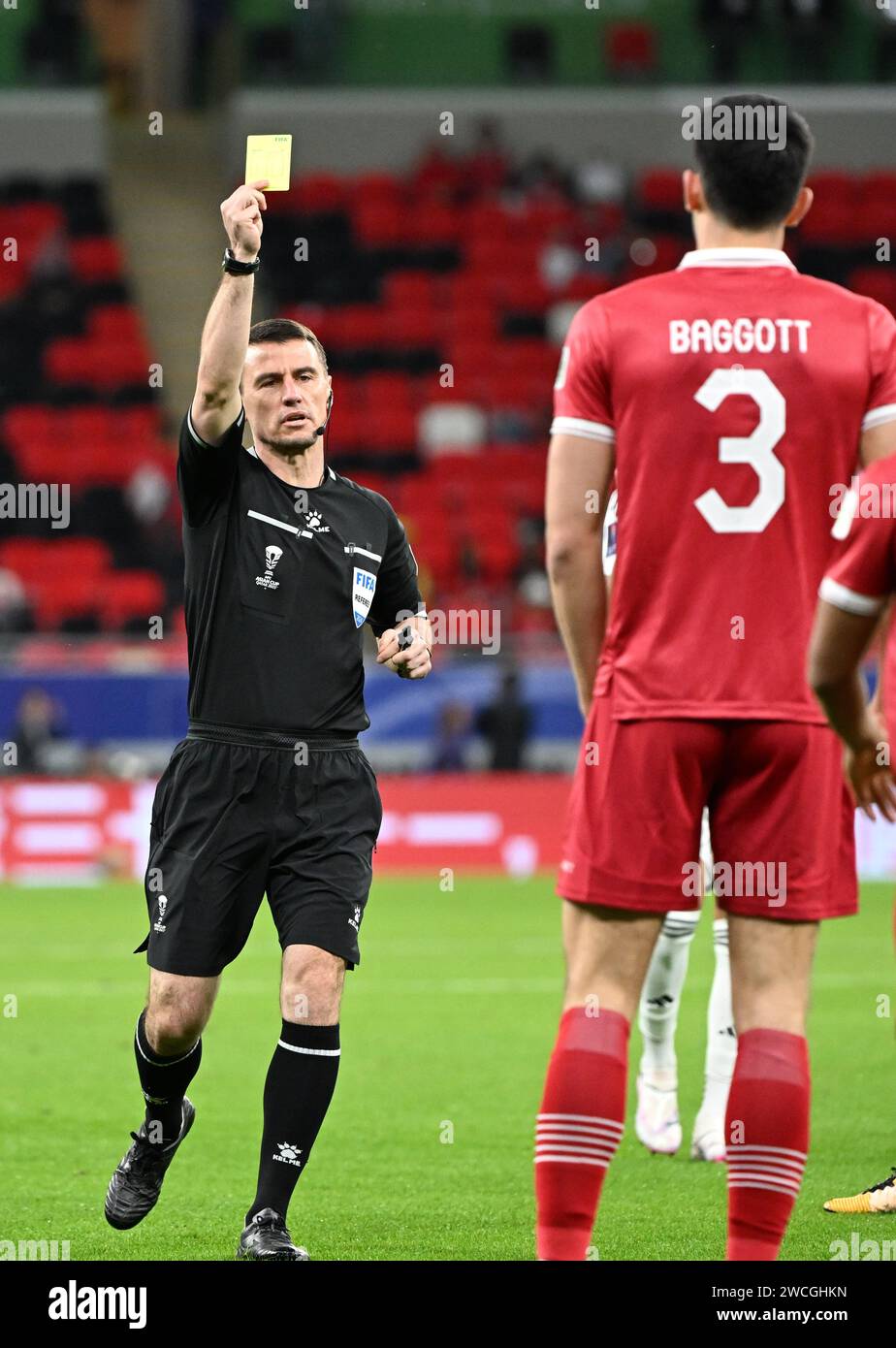 Doha, Qatar. 15th Jan, 2024. Referee shows yellow card to Elkan Baggott ...
