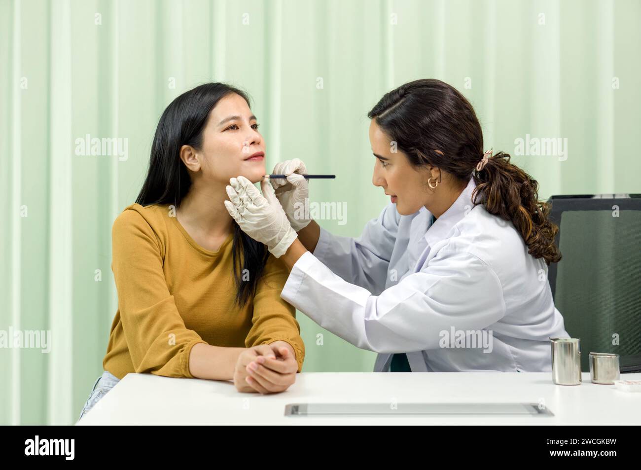 A professional healthcare provider is precisely performing a chin ...
