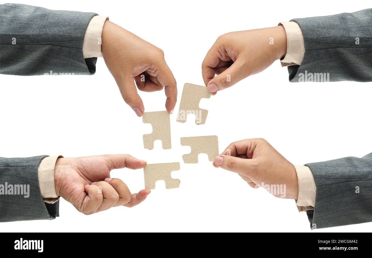 Collection of business hand holding a single piece of puzzle isolated ...