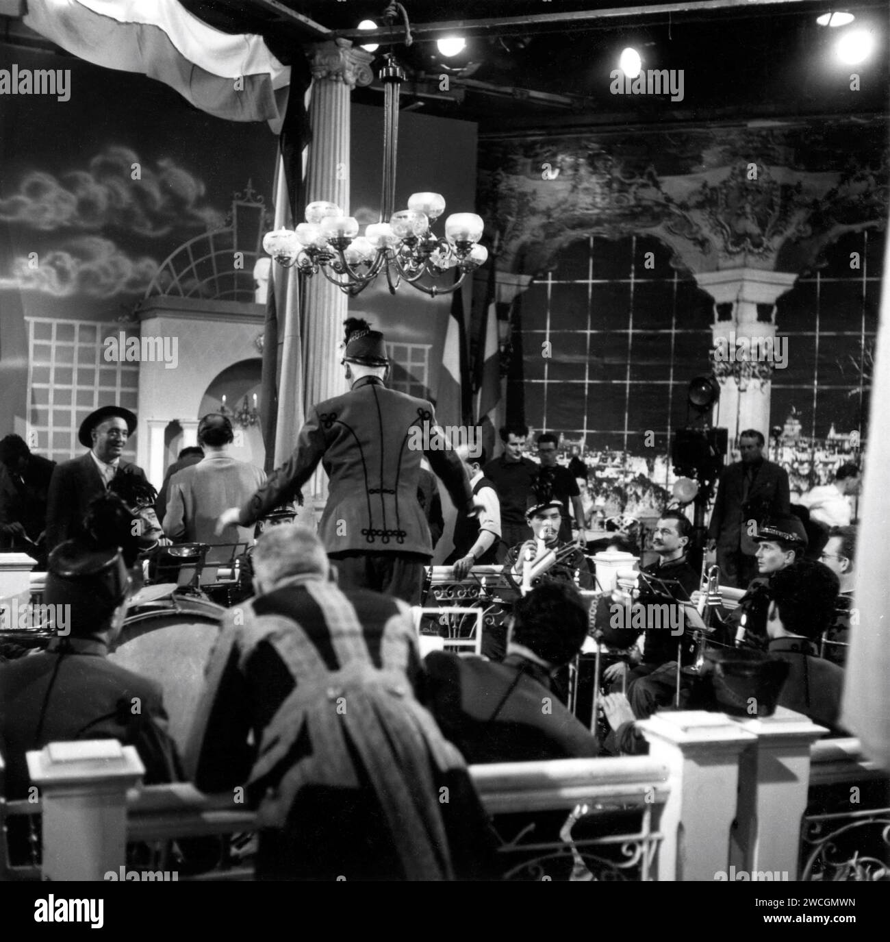 Director MAX OPHULS (far left with hat) on set candid during filming of ...